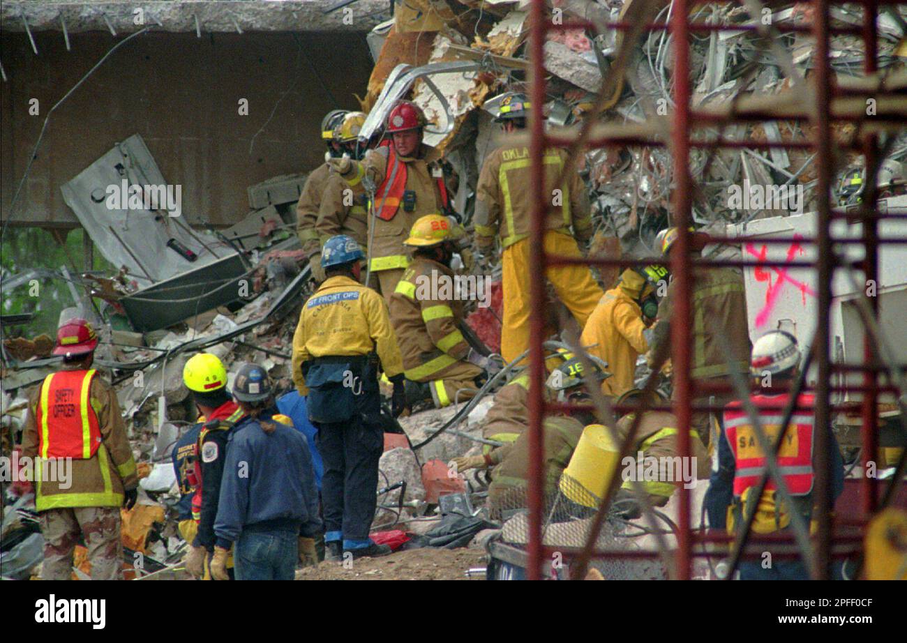 Search and rescue crews in Oklahoma City dig through the rubble at a ...