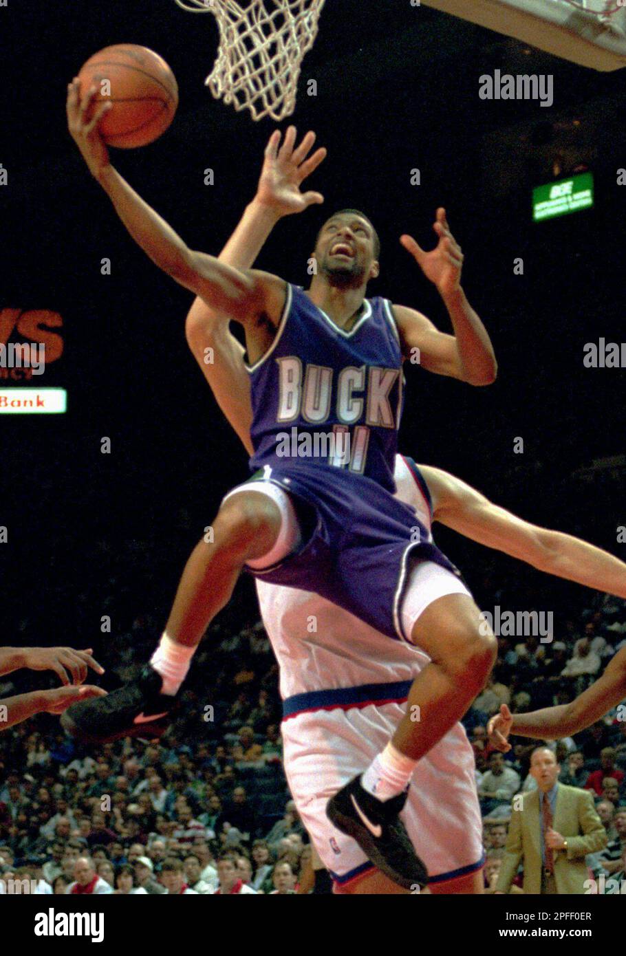Milwaukee's Lee Mayberry (11) drives to the basket while Washington's ...