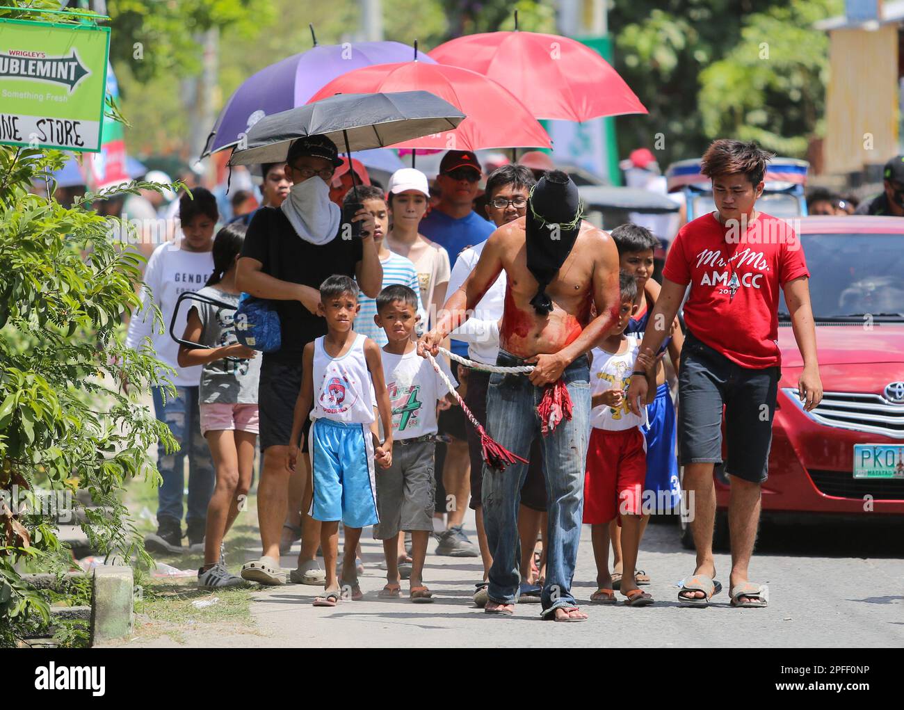 Penitents and flagellants parade for Holy Week and Good Friday ...