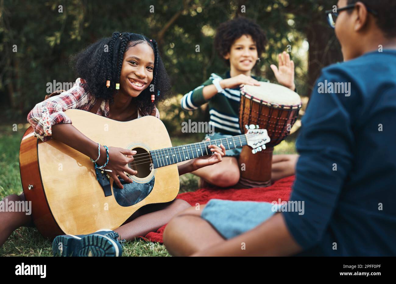 Every summer camp has a soundtrack. a group of teenagers playing ...