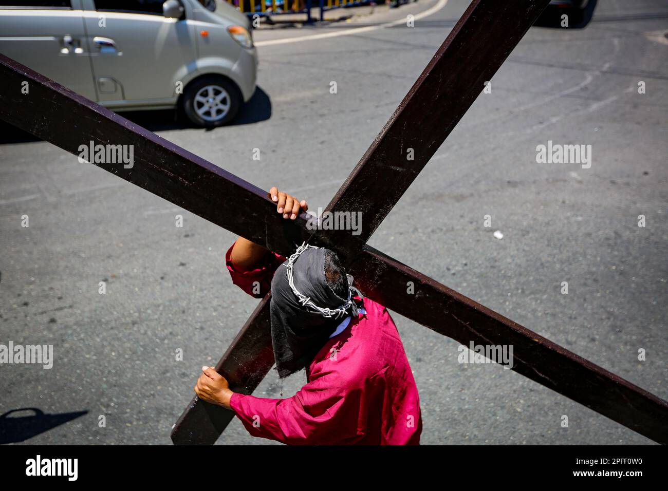 Penitent carrying his cross, flagellants parade, Holy Week, Good Friday ...
