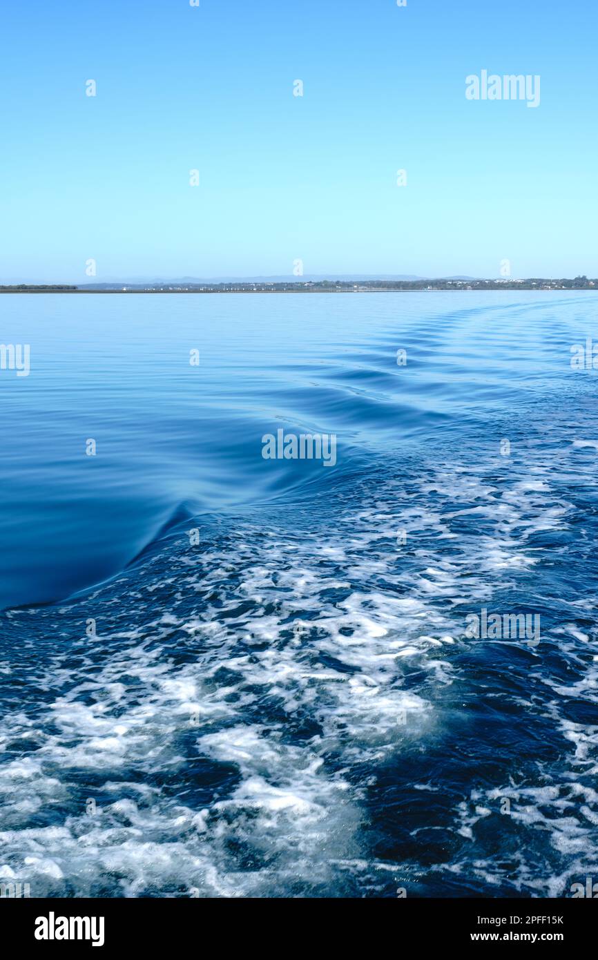 Lines on the calm blue sea in the wake behind a ferry Stock Photo - Alamy