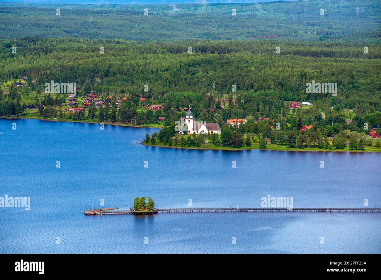 Aerial view of Rättvik church and long bridge in lake Siljan, Dalarna ...