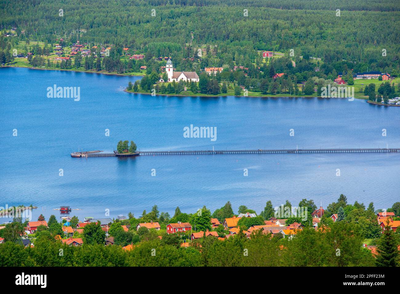 Aerial view of Rättvik church and long bridge in lake Siljan, Dalarna ...