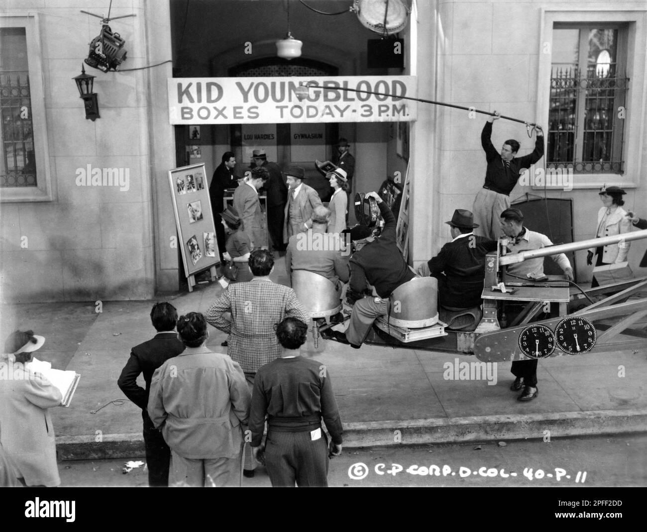 WILLIAM HOLDEN ADOLPHE MENJOU and BARBARA STANWYCK on set candid with ...