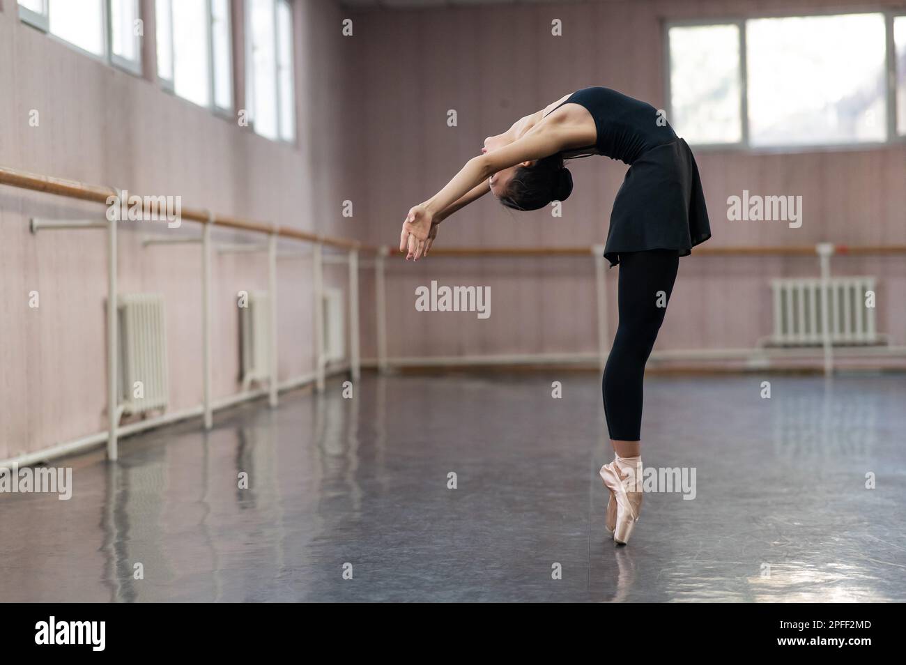 Asian woman dancing in ballet class. Bending in the back Stock Photo ...