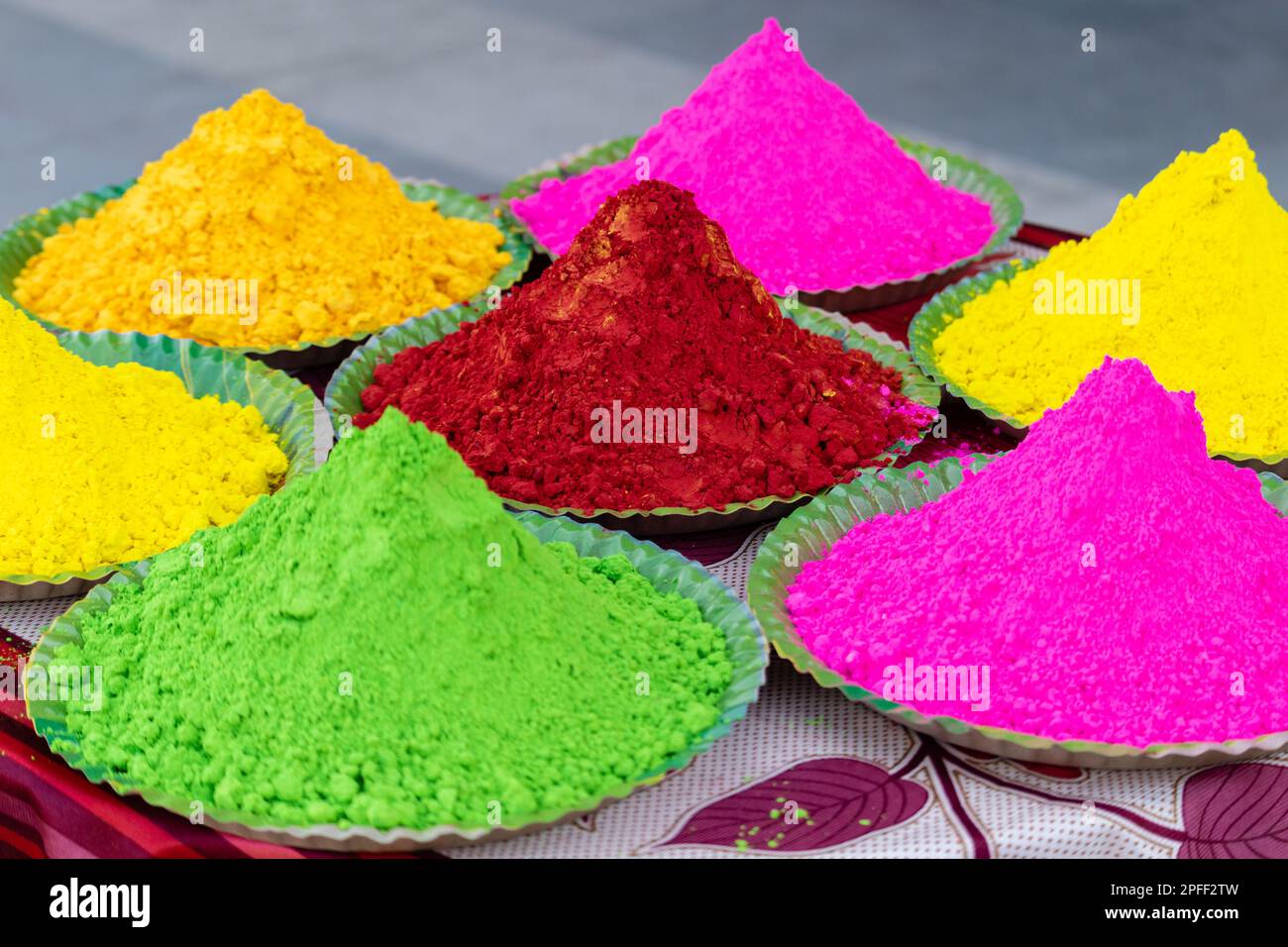 Heaps of colorful powder paints arranged in plates during holi festival ...
