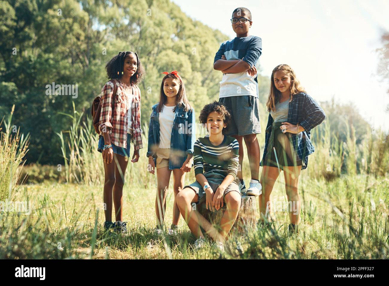 Camp time is the best time. a group of teenagers having fun in nature ...