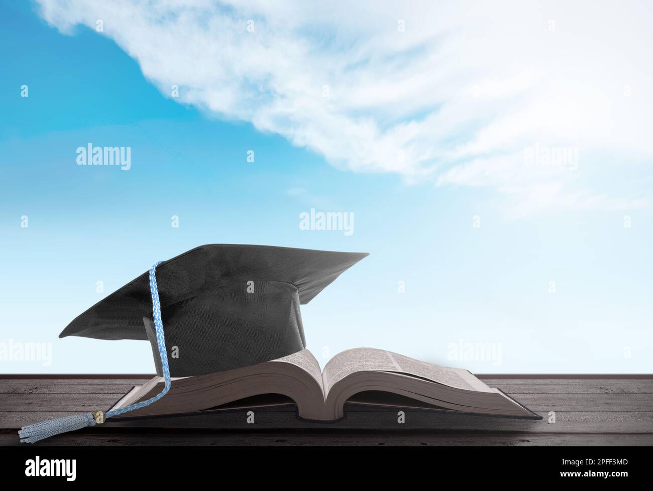 Education opened book graduation cap hi-res stock photography and ...