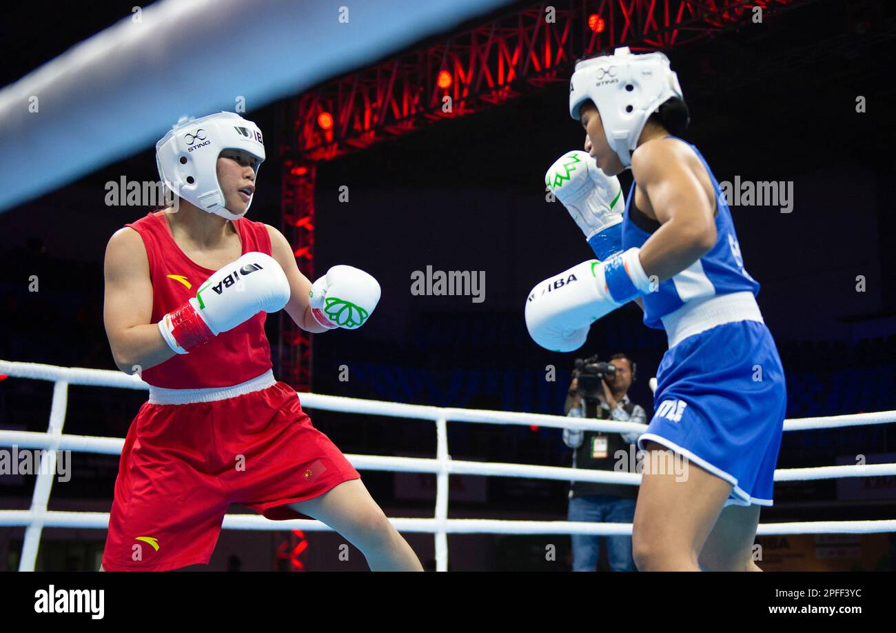 New Delhi. 16th Mar, 2023. Li Yijie (L) of China competes during the ...