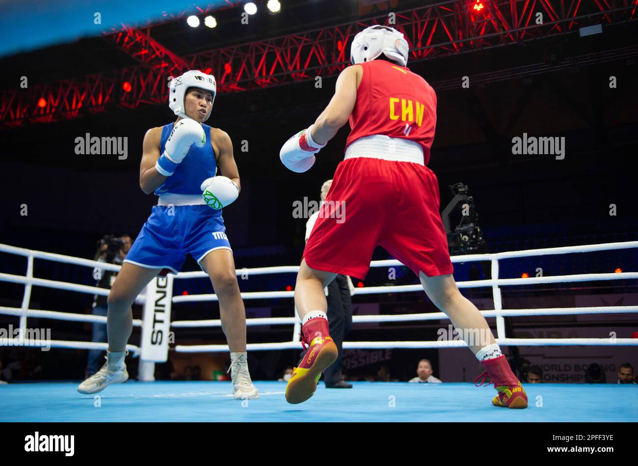 New Delhi. 16th Mar, 2023. Li Yijie (R) of China competes during the ...