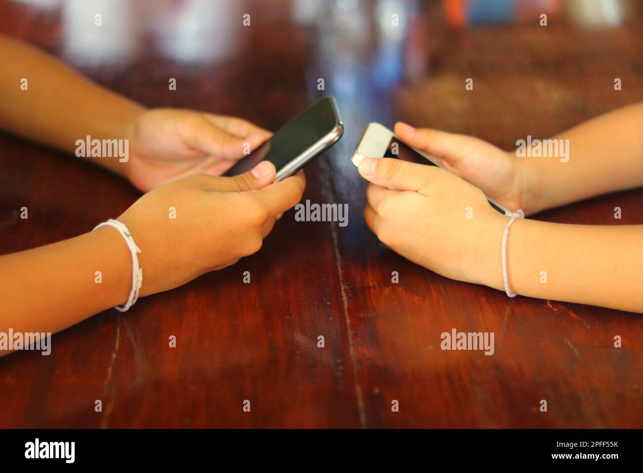 Young hands using smart phones - teenagers sharing content on social ...