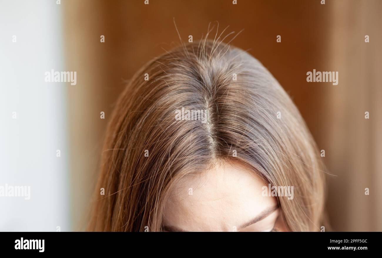Parting of women's hair on the head. Hair care and care Stock Photo - Alamy