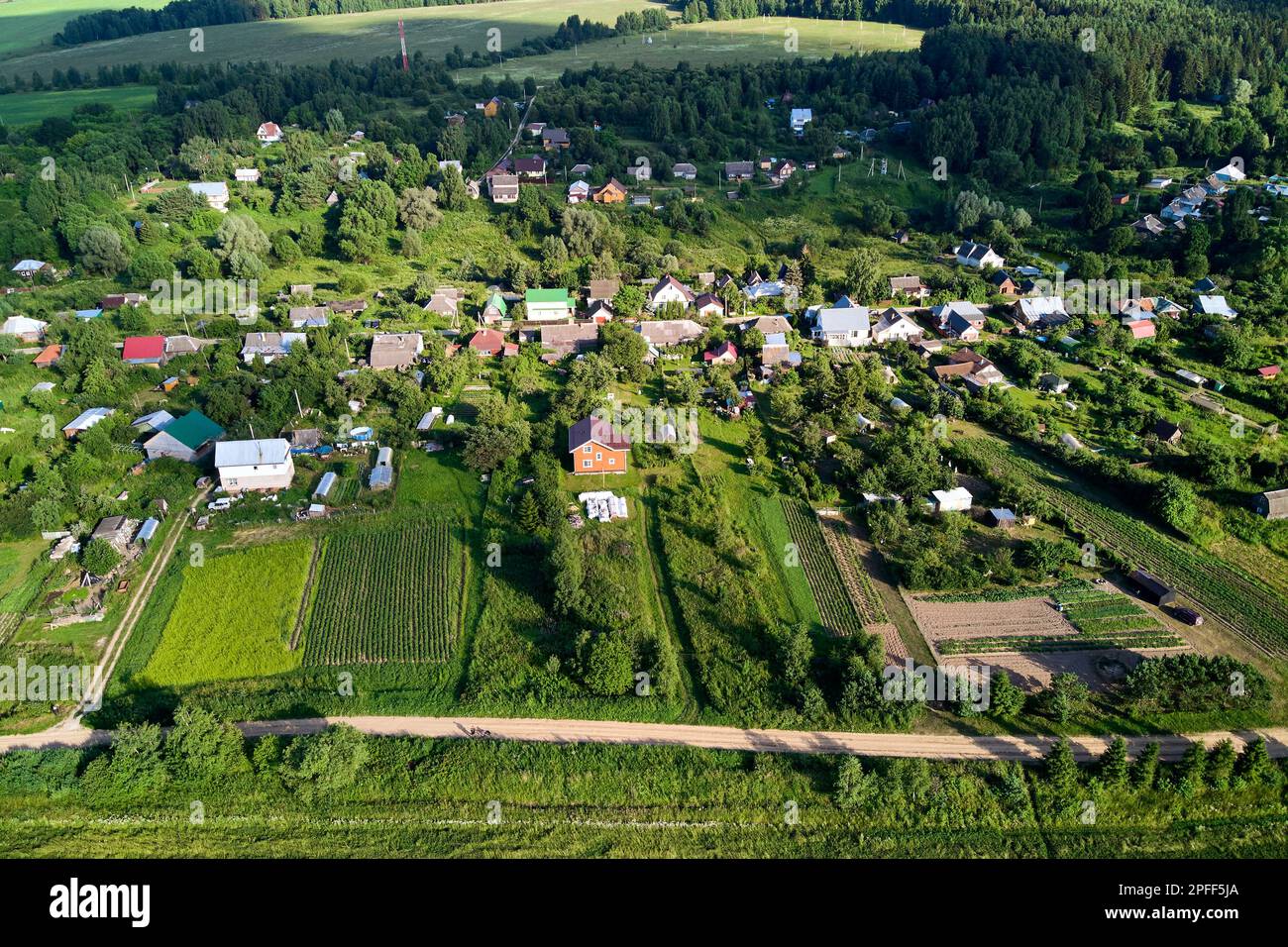 Aerial view of village plots with vegetable gardens and houses ...