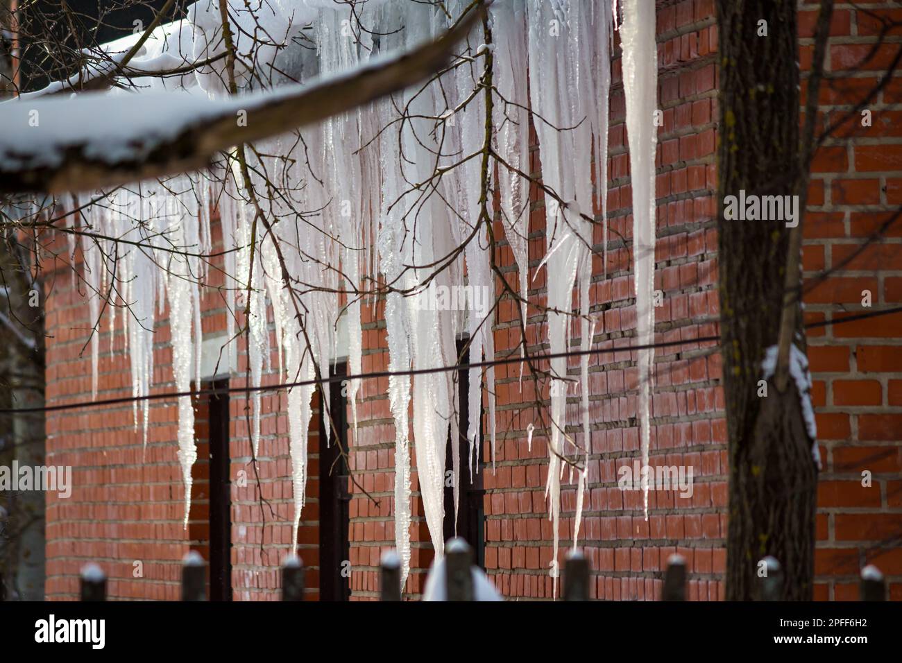 Large dangerous icicles roof hi-res stock photography and images - Alamy