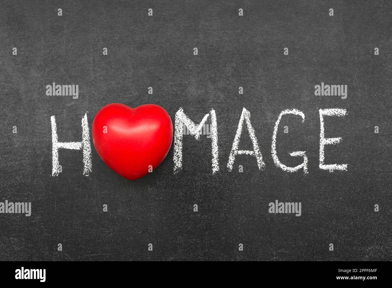 homage word handwritten on chalkboard with heart symbol instead of O ...