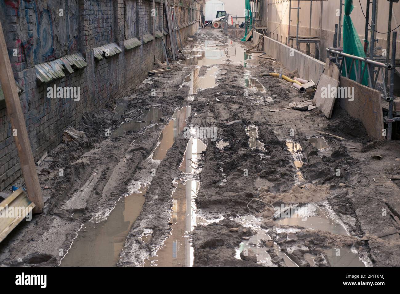 dirty backyard with many puddles and remains of construction work Stock ...