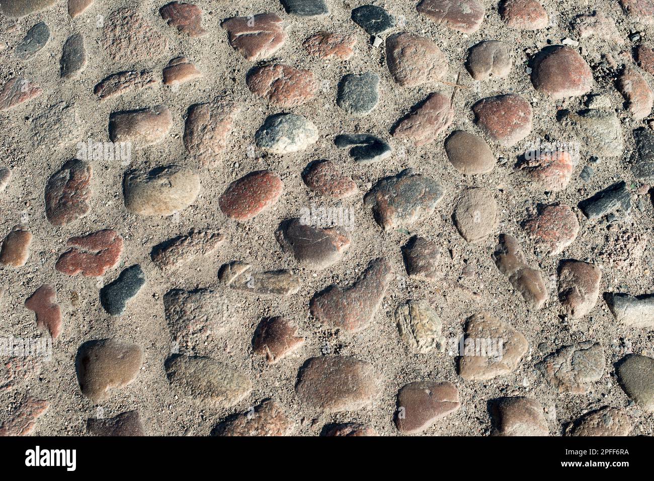 ancient rough stone pavement surface by bright sunny day Stock Photo ...