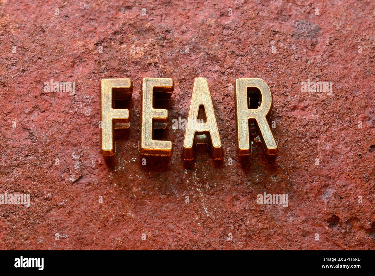 fear word made from metallic letters on red rusty surface Stock Photo - Alamy