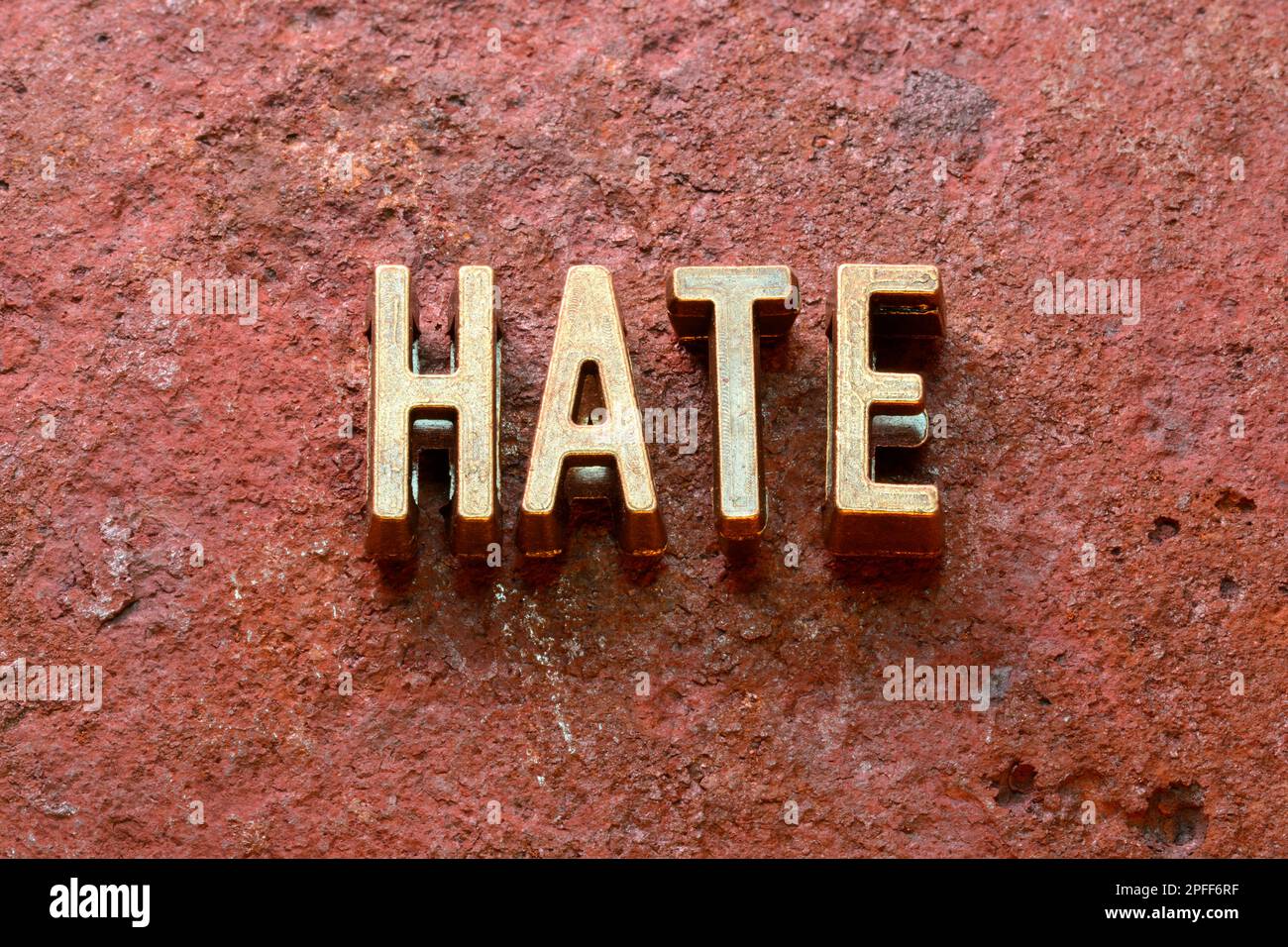 hate word made from metallic letters on red rusty surface Stock Photo ...
