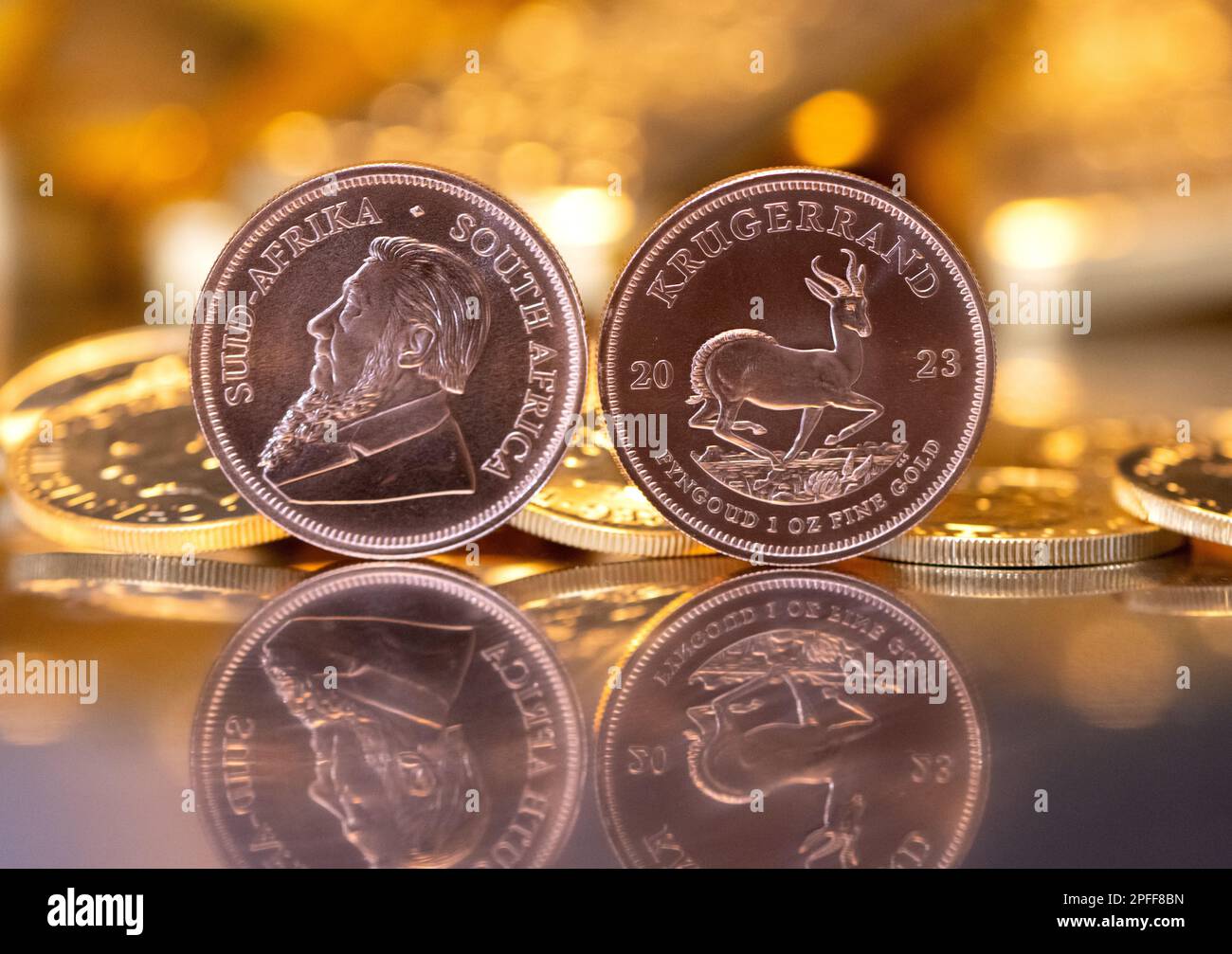 Munich, Germany. 16th Mar, 2023. Gold bars and gold coins in different ...