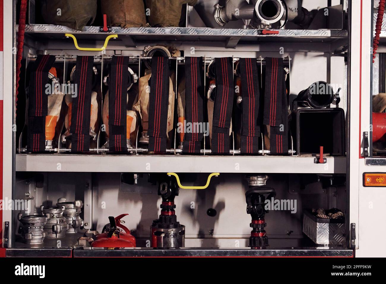 Inside of fire truck. Close up view of equipment and hoses Stock Photo ...