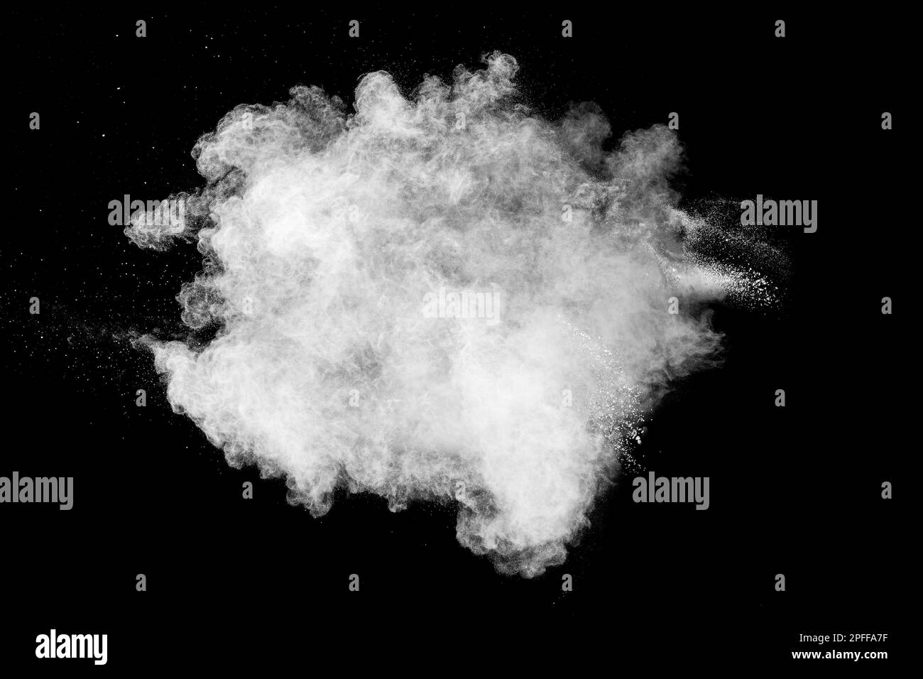 White powder explosion cloud against black background. White dust ...