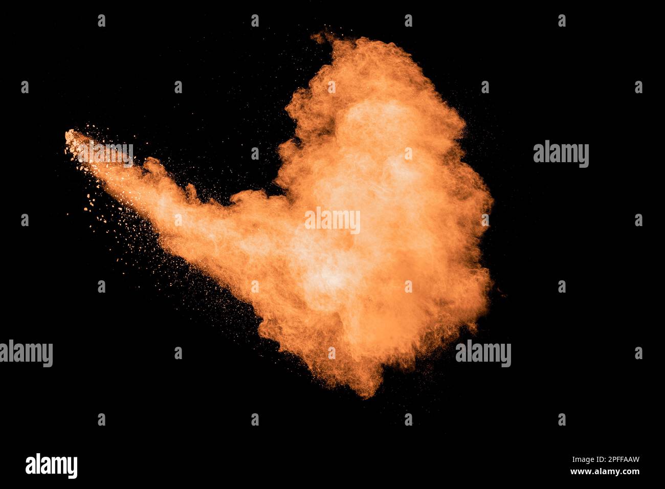 Orange powder explosion on white background Stock Photo - Alamy