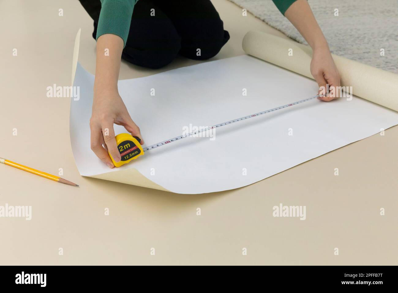 DIY interior hand motion, closeup wallpaper length measurement Stock ...