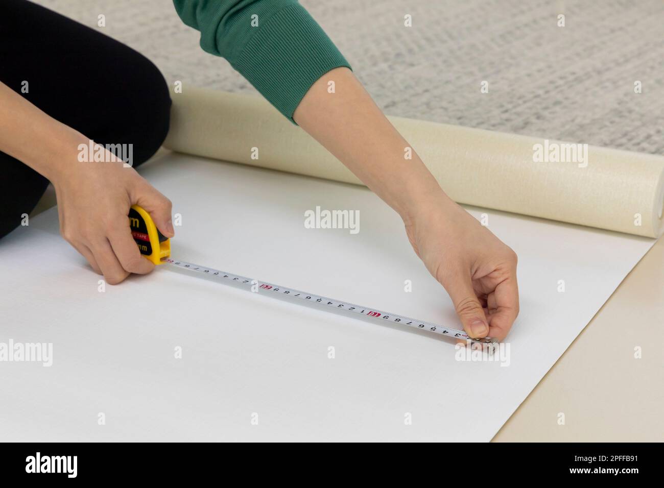 DIY interior hand motion, closeup wallpaper length measurement Stock ...