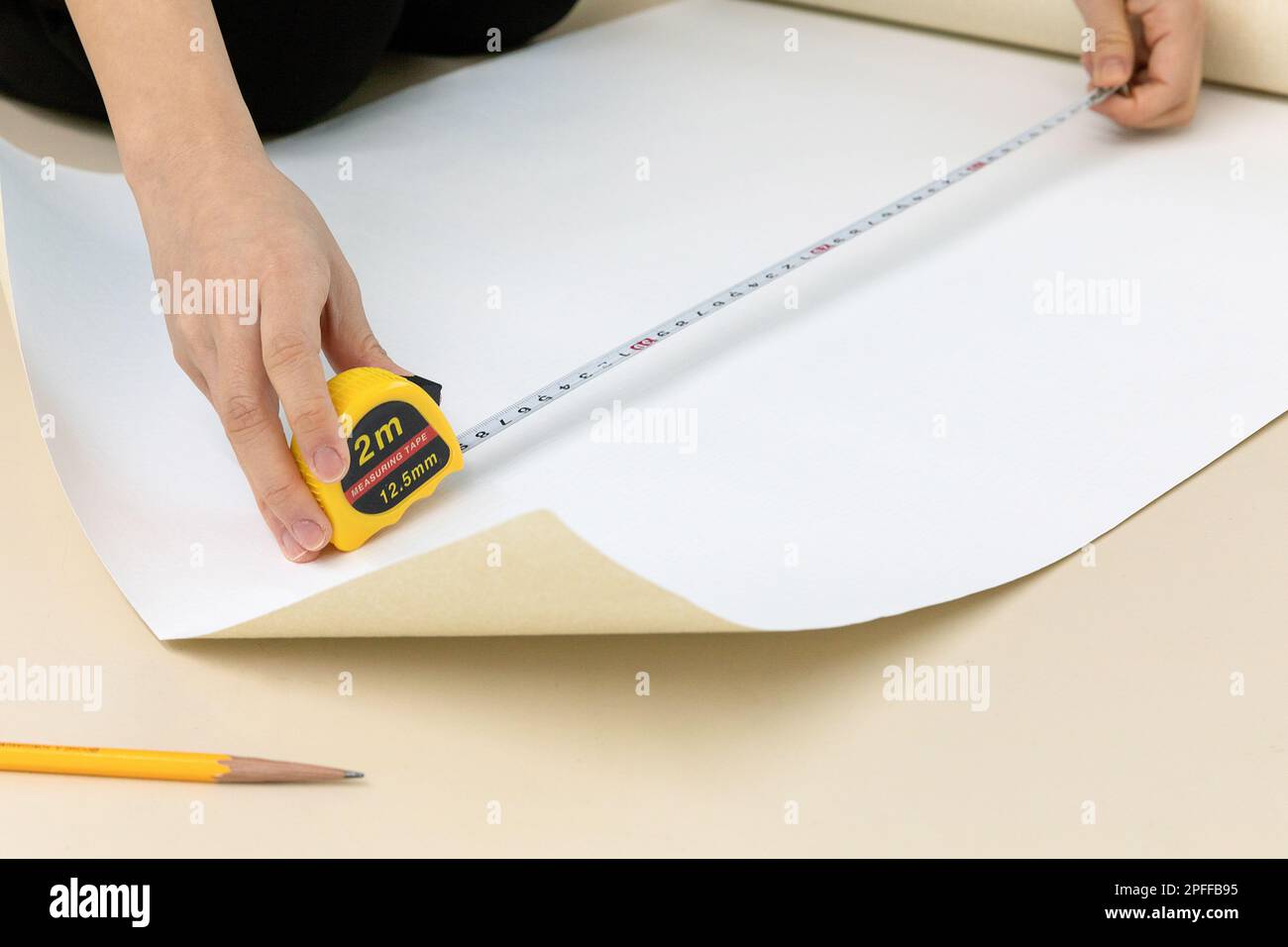 DIY interior hand motion, closeup wallpaper length measurement Stock ...