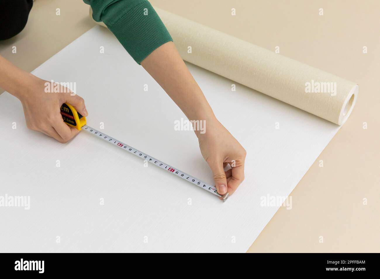 DIY interior hand motion, closeup wallpaper length measurement Stock ...