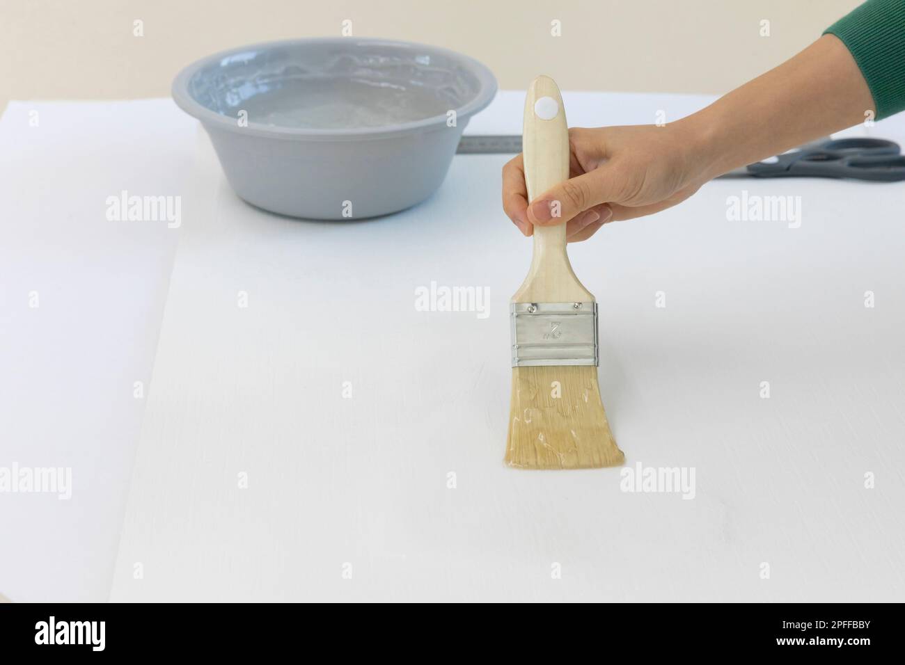 DIY interior hand motion, closeup apply paste to wallpaper Stock Photo ...