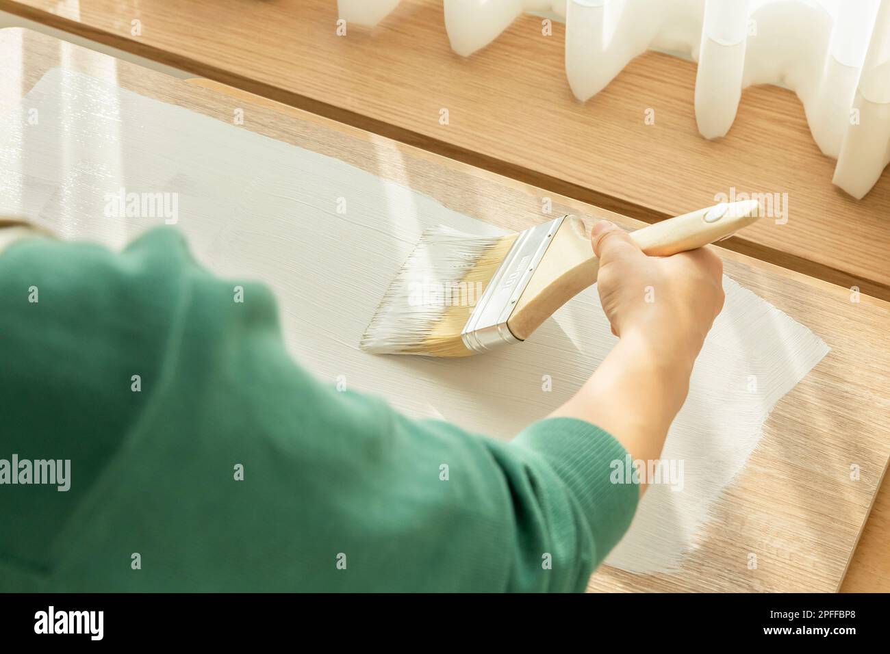 DIY interior hand motion, closeup painting Stock Photo - Alamy