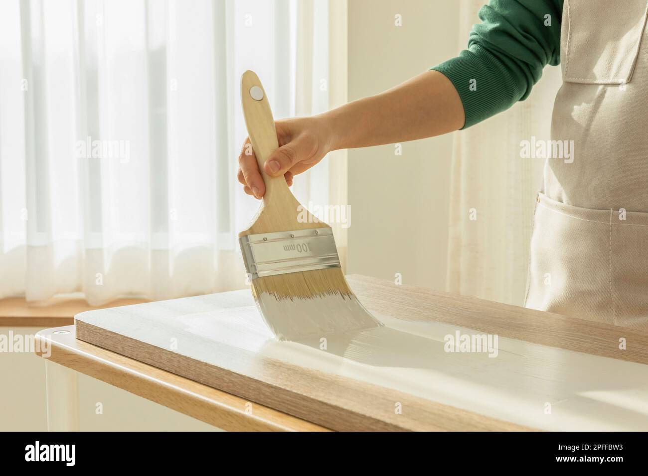 DIY interior hand motion, closeup painting Stock Photo - Alamy