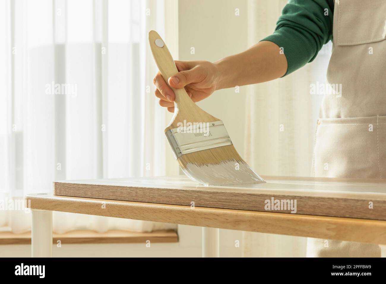 DIY interior hand motion, closeup painting Stock Photo - Alamy
