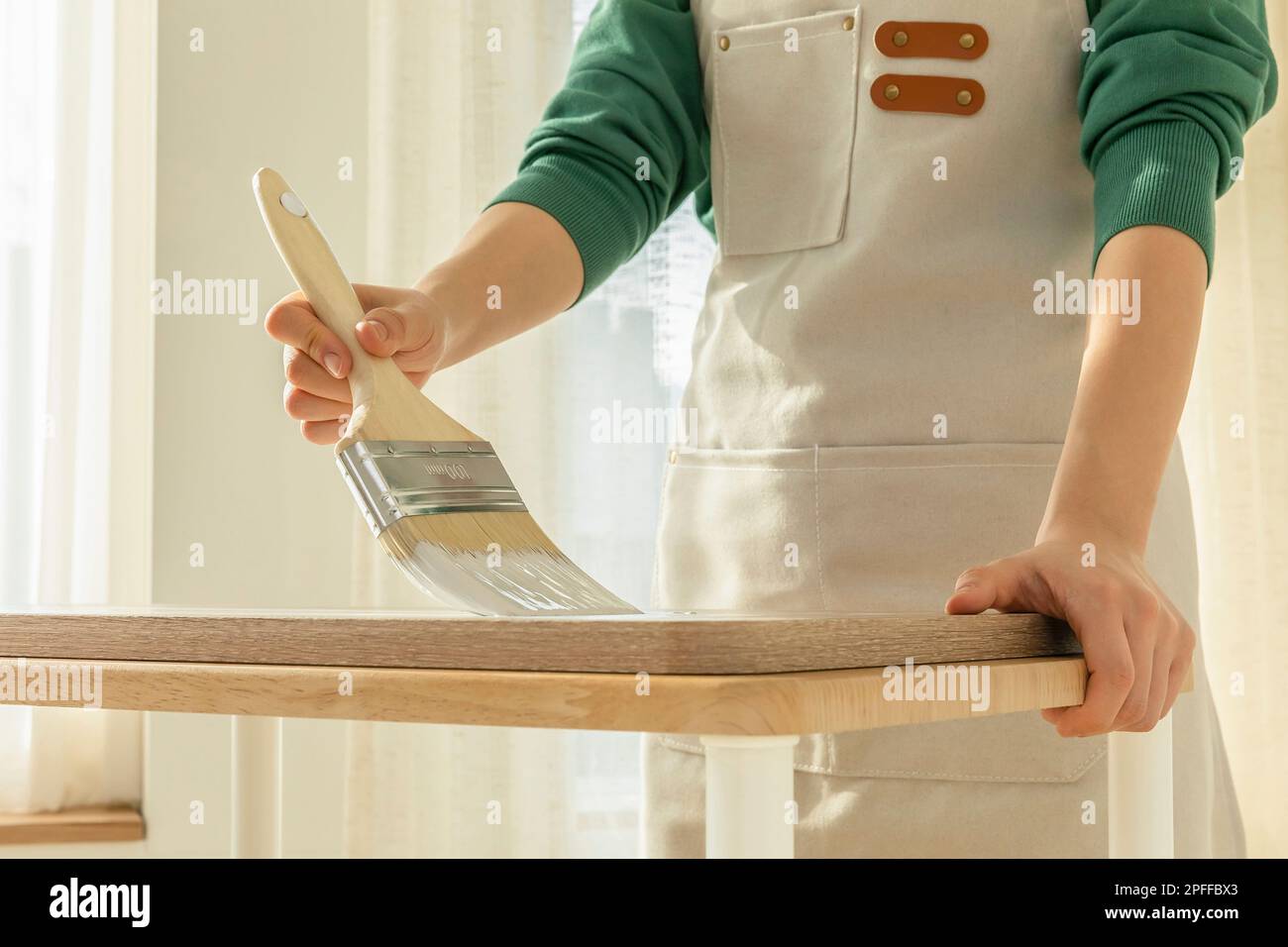 DIY interior hand motion, closeup painting Stock Photo - Alamy