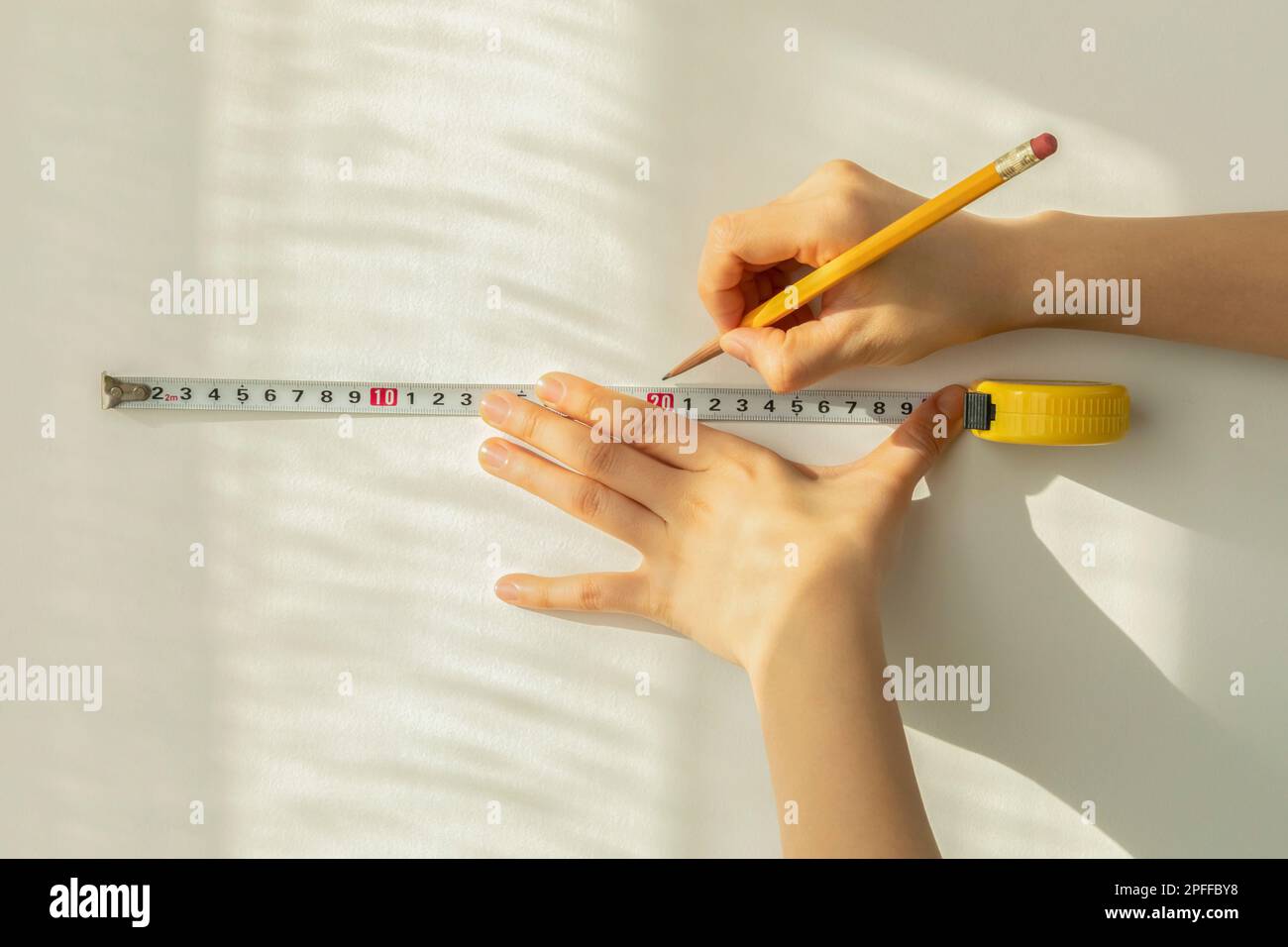 DIY interior hand motion, closeup wallpaper length measurement Stock ...