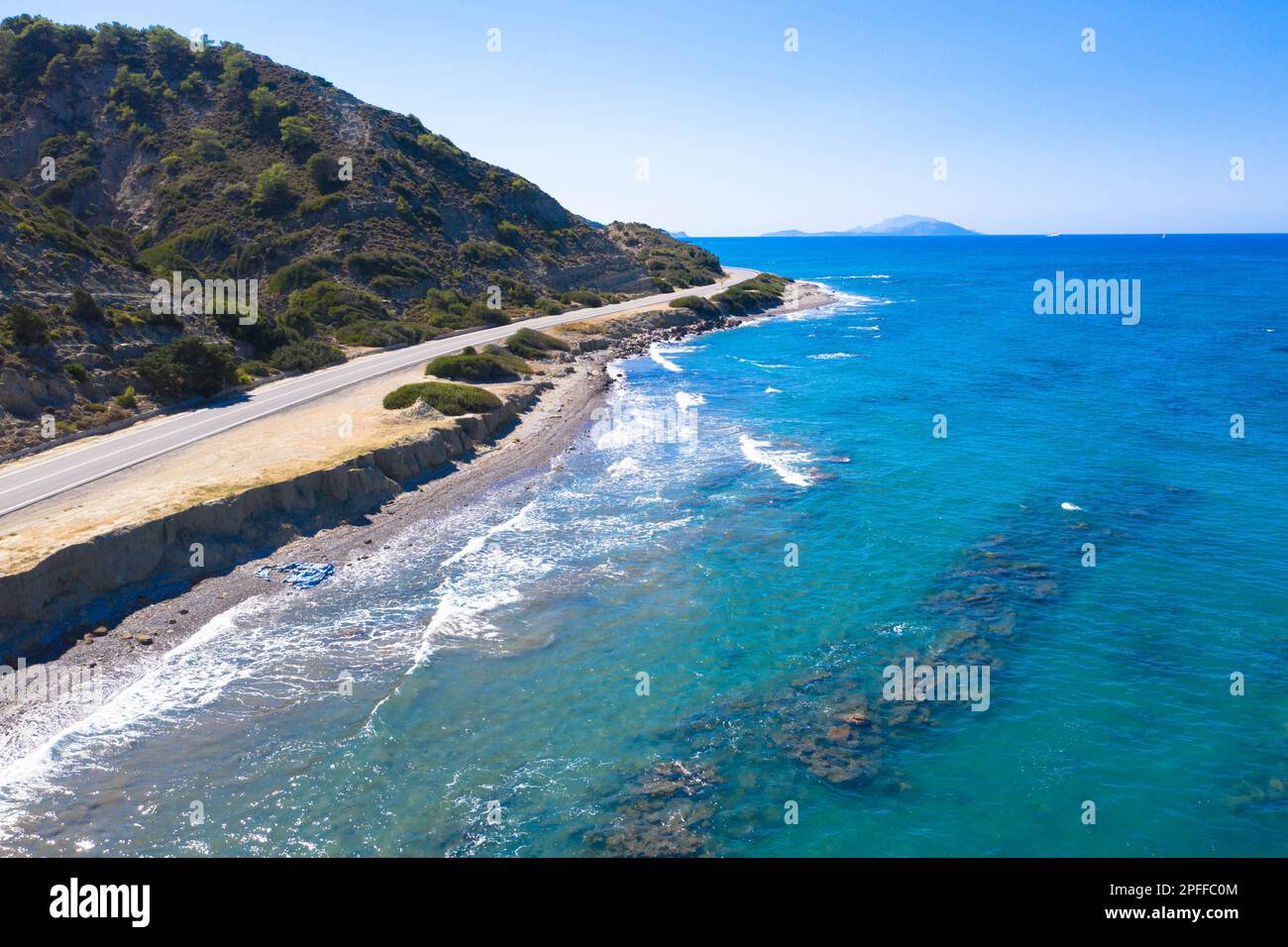 Aerial view of Amiros Beach along the beautiful country road. Located ...