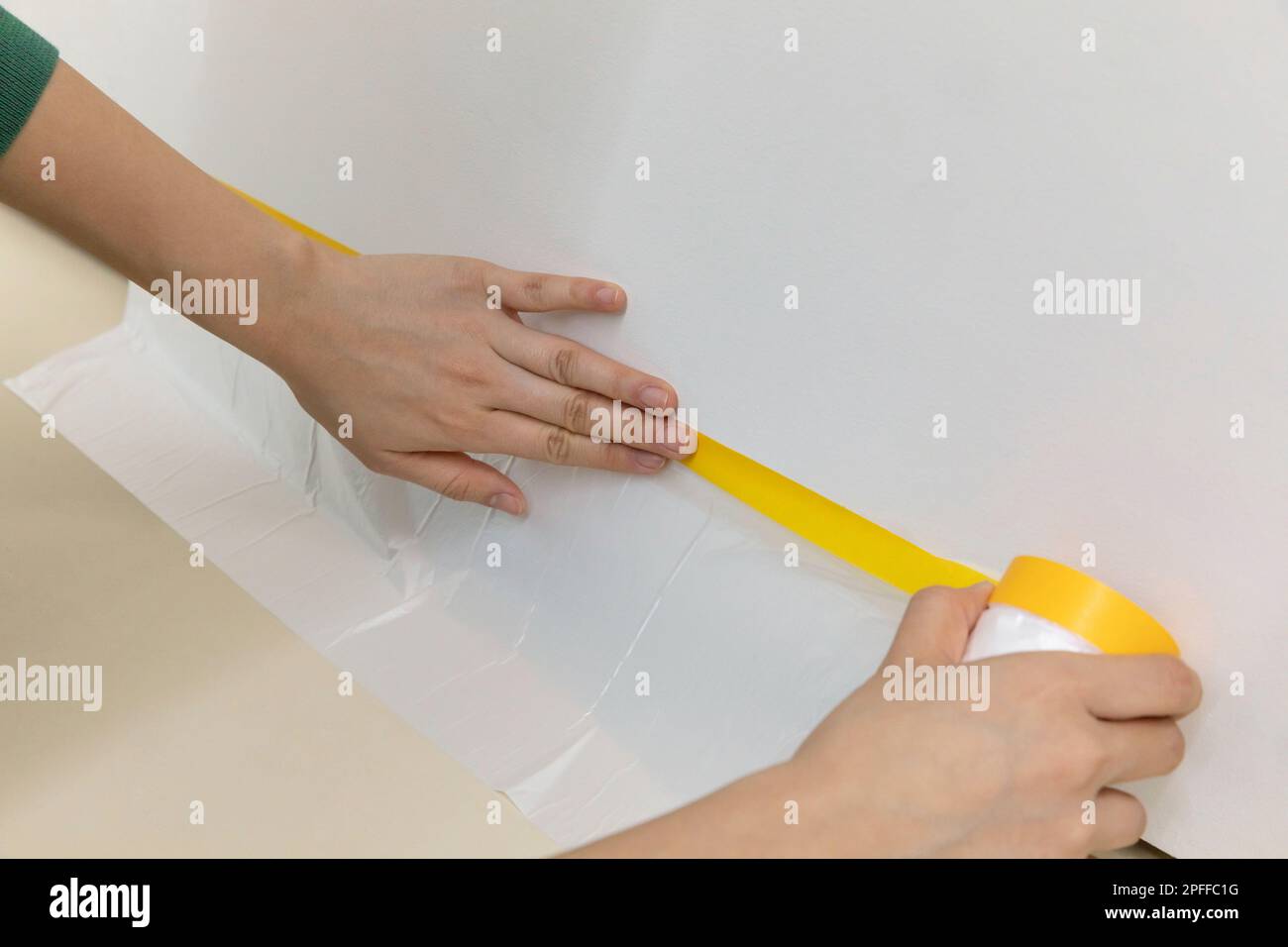 DIY interior hand motion, closeup putting on covering tape Stock Photo ...