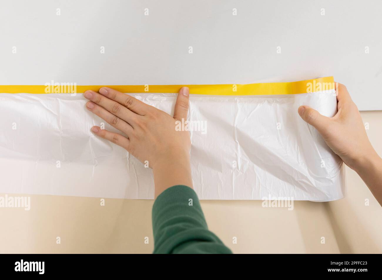 DIY interior hand motion, closeup putting on covering tape Stock Photo ...