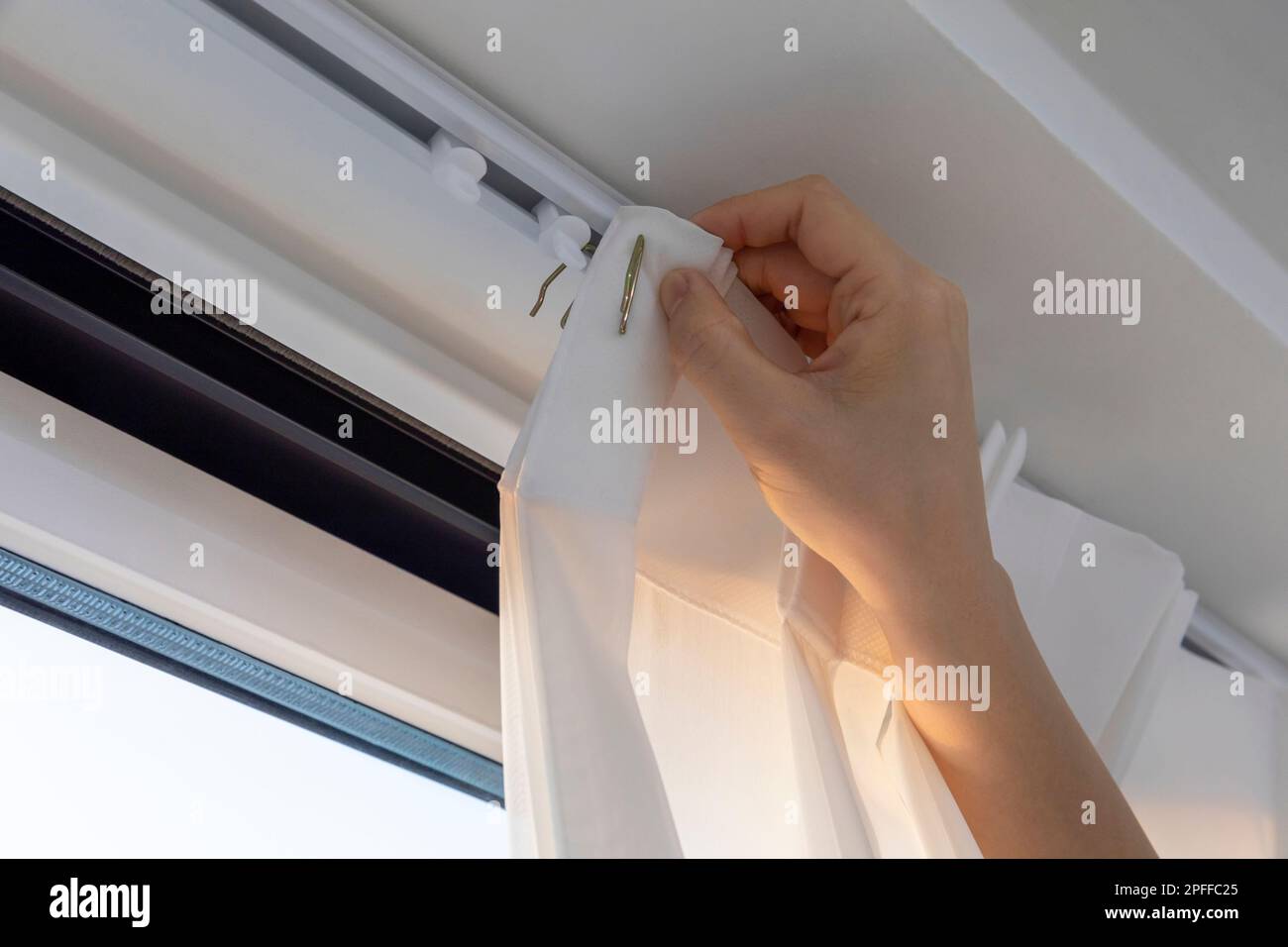 DIY interior hand motion, closeup curtain construction Stock Photo - Alamy