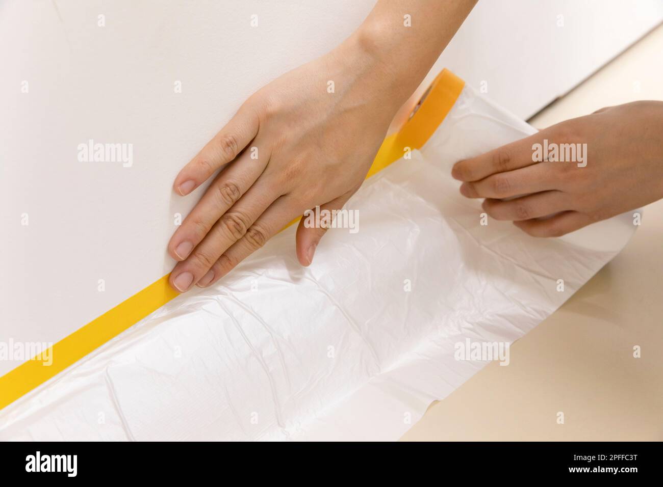 DIY interior hand motion, closeup putting on covering tape Stock Photo ...