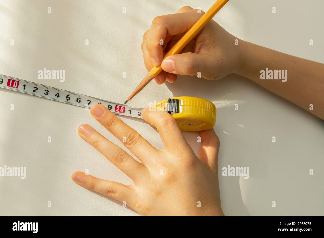 DIY interior hand motion, closeup wallpaper length measurement Stock ...