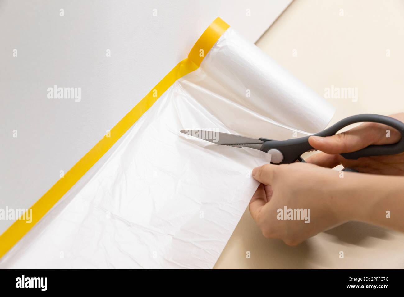 DIY interior hand motion, closeup putting on covering tape Stock Photo ...