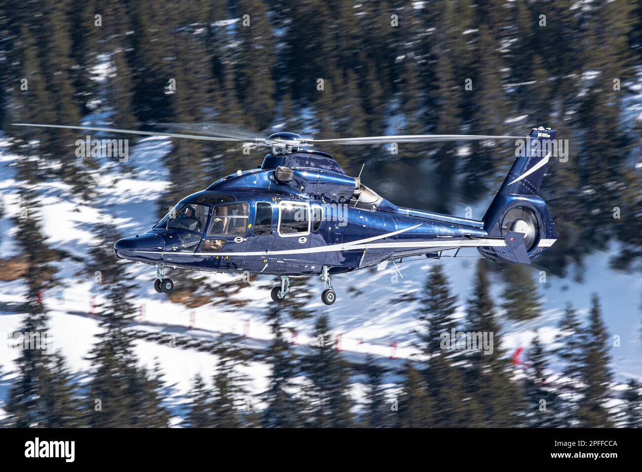 Blue Airbus Helicopter EC155 preparing for landing in Courchevel Stock ...