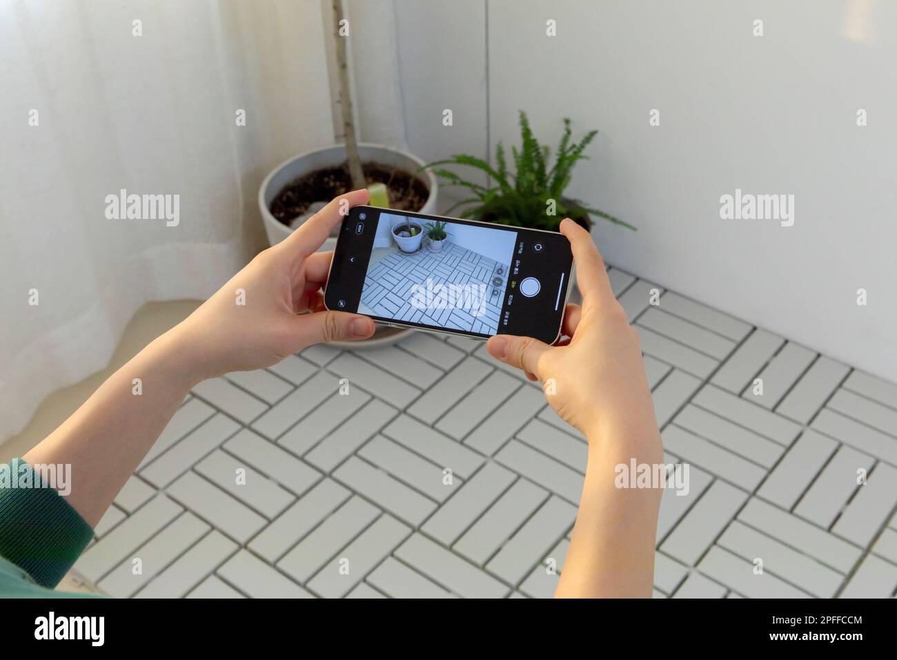 DIY interior hand motion, closeup taking a picture floor tile Stock ...