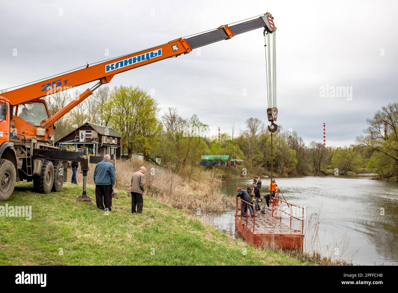 OBNINSK, RUSSIA - APR. 2015: Installation of the pontoon bridge on the ...