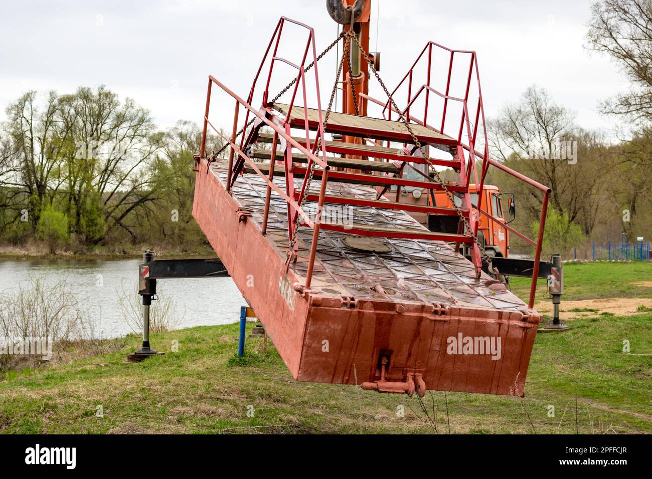 OBNINSK, RUSSIA - APR. 2015: Installation of the pontoon bridge on the ...