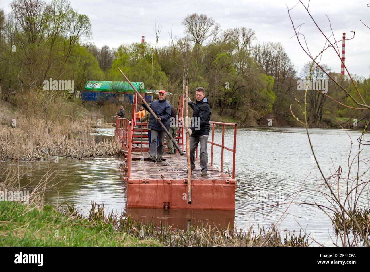 OBNINSK, RUSSIA - APR. 2015: Installation of the pontoon bridge on the ...
